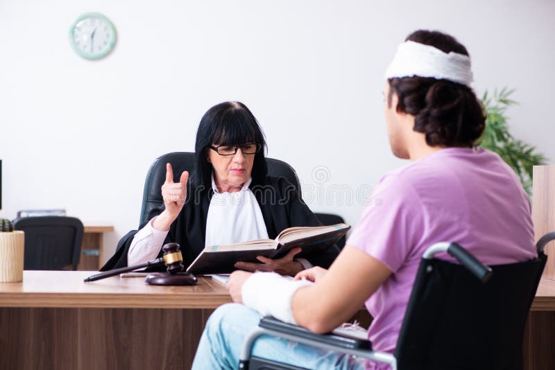Disabled Man Consulting Judge for Damages Litigation Stock Photo ...