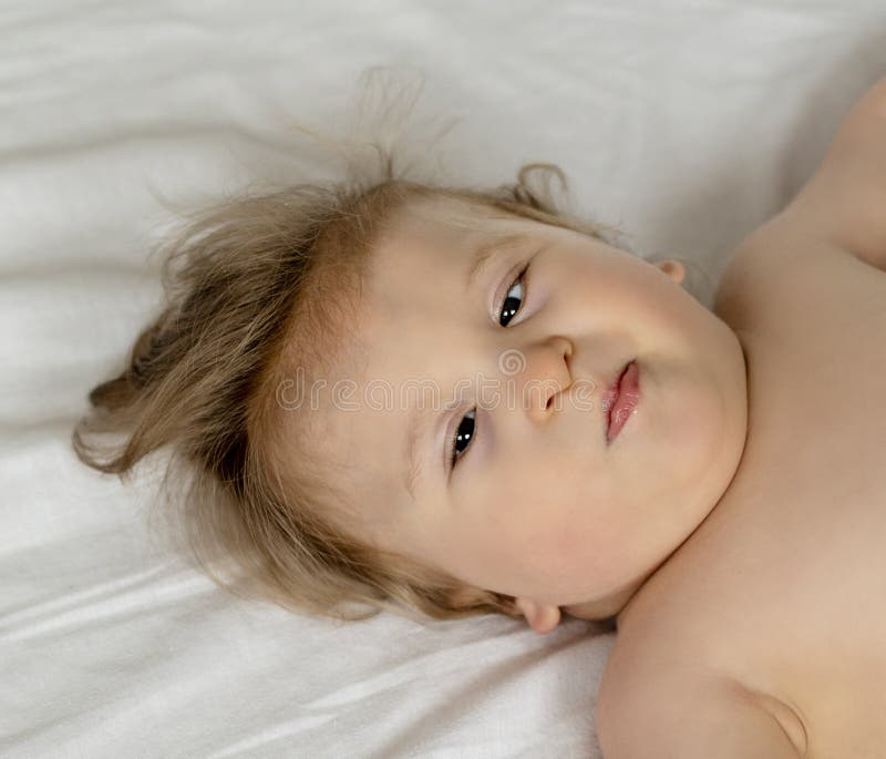 Disabled One Year Old Baby Lying on Bed - Image Stock Image - Image of ...