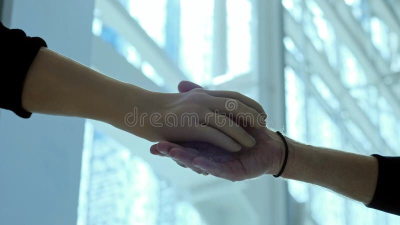A Disabled Person without a Hand with a Prosthesis Shakes Hands with a ...