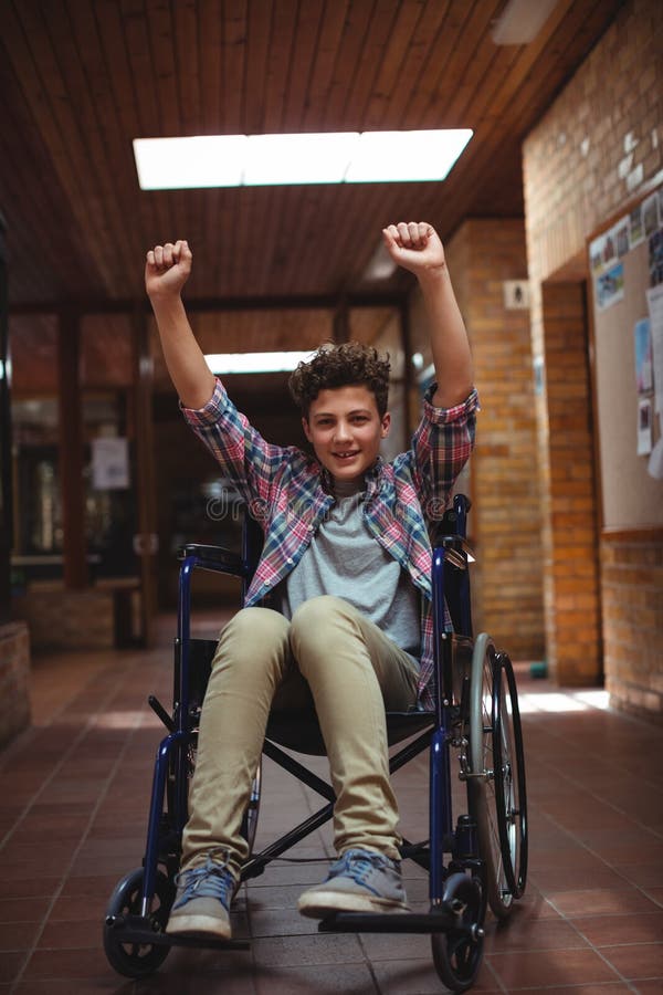 Disabled Schoolboy on Wheelchair in Corridor at School Stock Photo ...