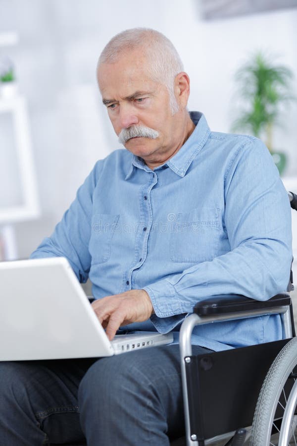 Disabled Senior Man Sitting in Wheelchair Using Laptop Stock Image ...