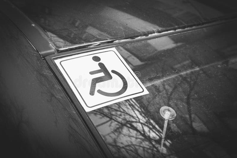 Disabled Sign on the Car Glass. Stock Image - Image of glass, asphalt ...