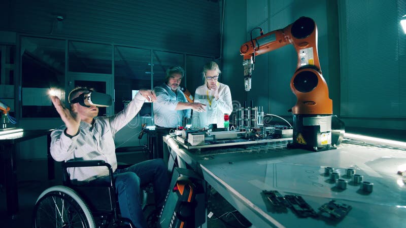 Disabled Engineer is Using VR To Control a Robotic Arm Stock Video ...