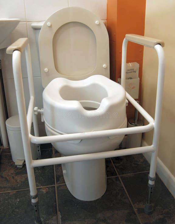 Disabled Toilet with Handles and Raised Seat Stock Photo - Image of ...