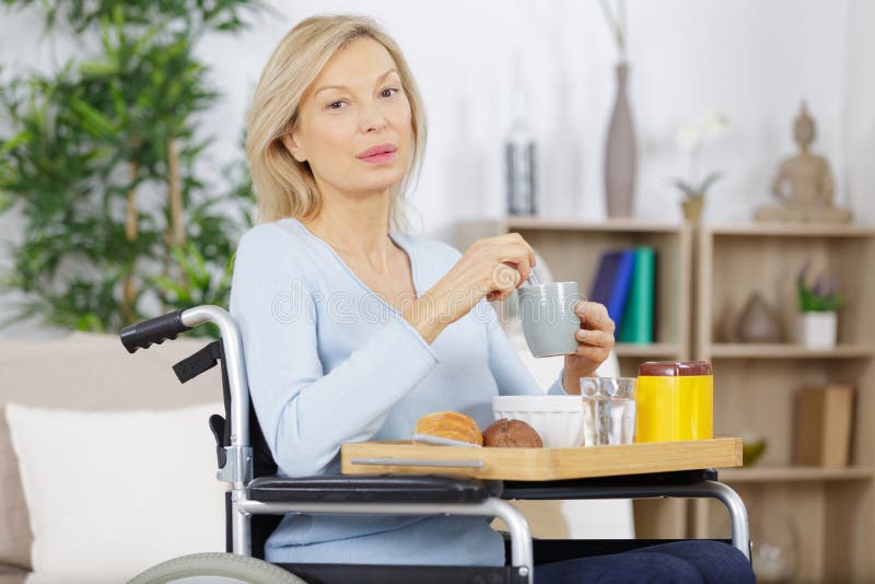 Disabled Woman Having Breakfast Stock Image - Image of assisted, meal ...