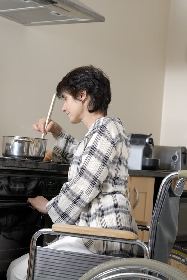Disabled Woman in Wheelchair Cooking Dinner Stock Image - Image of ...