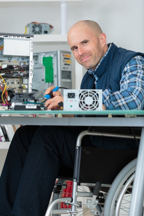 Disabled Worker in Wheelchair Fixing Computer Stock Photo - Image of ...