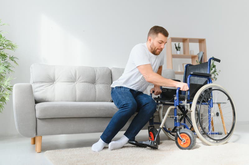Disabled Young Black Guy Trying Sit Down. Stock Photo - Image of rehab ...