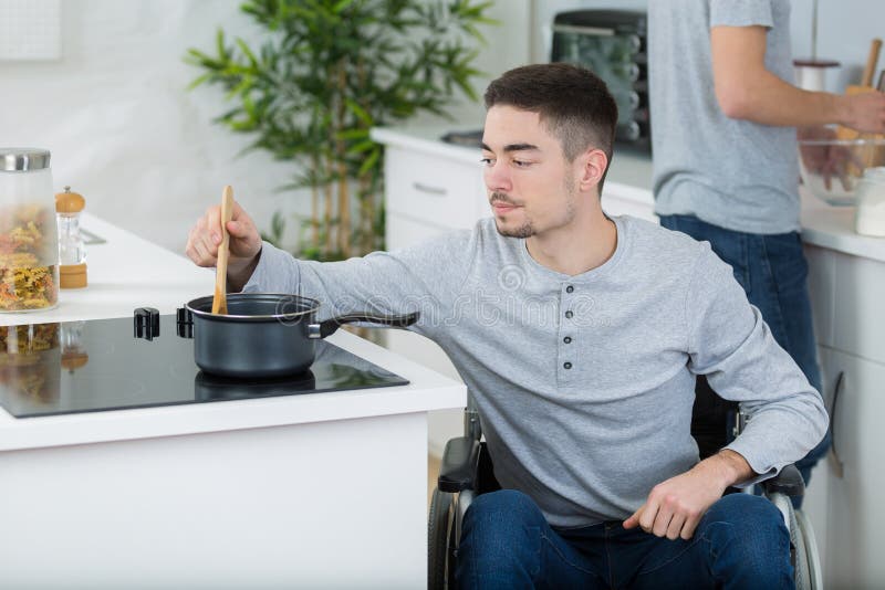 Disabled Young Man Cooking Meal in Kitchen Stock Photo - Image of ...