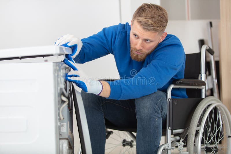 Disabled Young Repairman Repairing Washing Machine Stock Image - Image ...