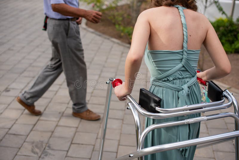 Rear View of Woman Using Posture Control Walker Stock Photo - Image of ...
