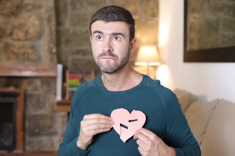 Disappointed Man Holding a Broken Heart Stock Photo - Image of ...