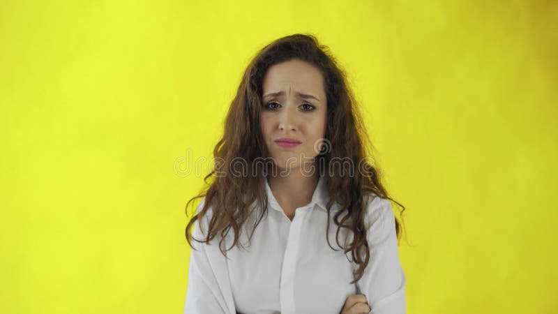 Disappointed and a Very Sad Young Woman almost Crying in Studio with ...