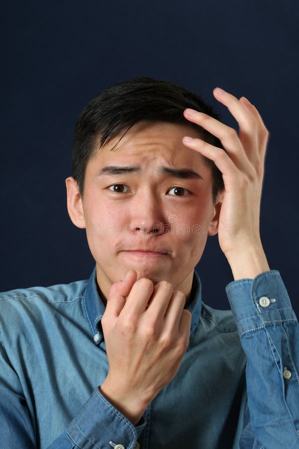 Disappointed Young Asian Man Looking at Camera Stock Image - Image of ...