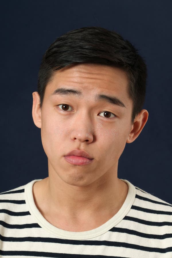 Disappointed Young Asian Man Stock Photo - Image of dark, melancholy ...