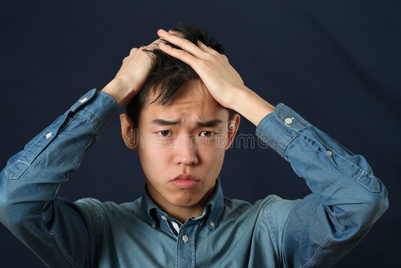 Disappointed Young Asian Man Making Face and Looking at Camera Stock ...
