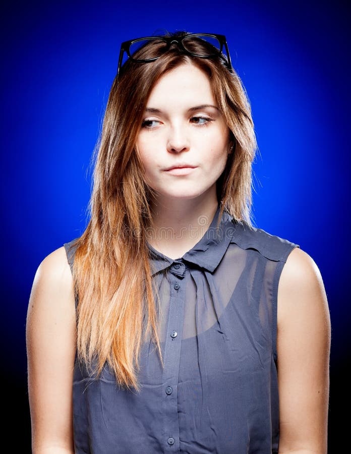 Disappointed Young Woman with Nerd Glasses on Head Looking Left Stock ...