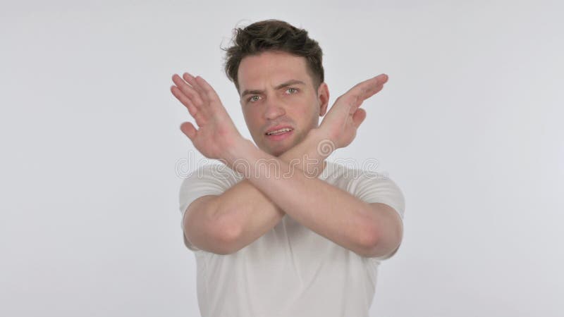 Disapproving Young Man Rejecting by Arm Gesture on White Background ...