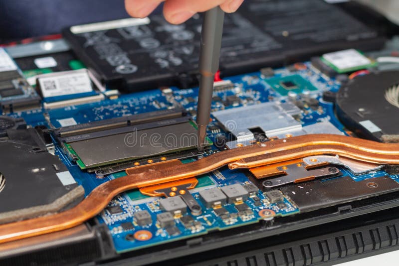 Disassemble the Laptop with a Screwdriver To Repair the Cooling System ...