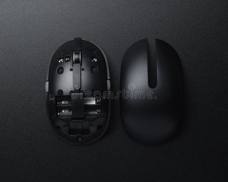 Disassembled Black Computer Mouse on a Black Plastic Background. Repair ...