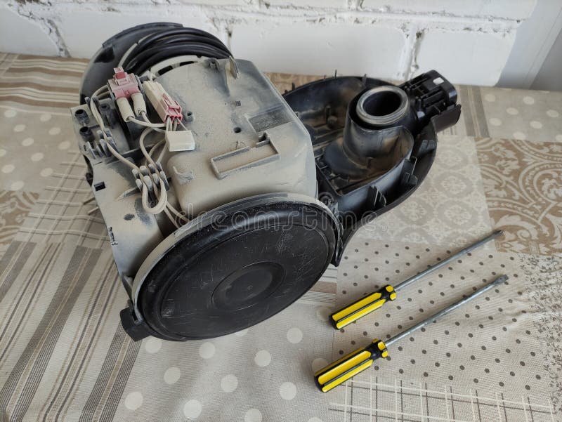 Disassembled Broken Vacuum Cleaner and Screwdrivers on the Table Stock ...