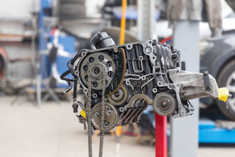 Disassembled Car Engine with Exposed Timing Chain and Gears in a ...