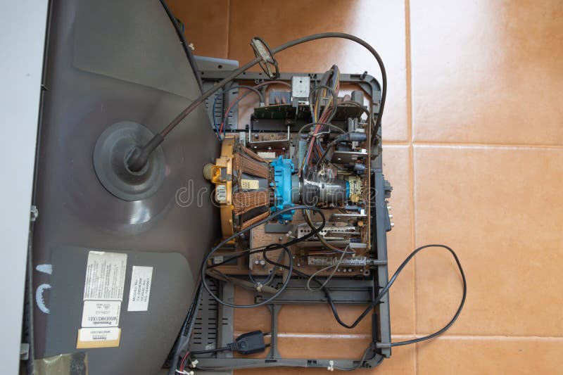 Disassembled Crt Television Showing Internal Components on Tile Floor ...