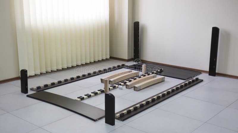 Disassembled Dark Wooden Bed on the Floor Stock Image - Image of simple ...