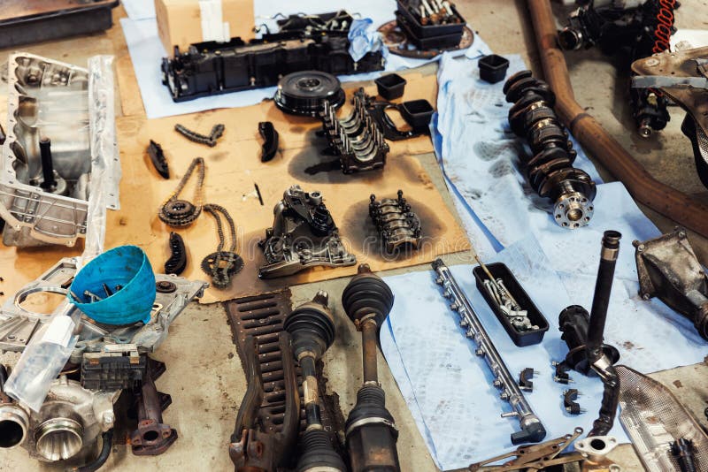 Disassembled Engine Components Spread Across Workshop Floor Showing ...