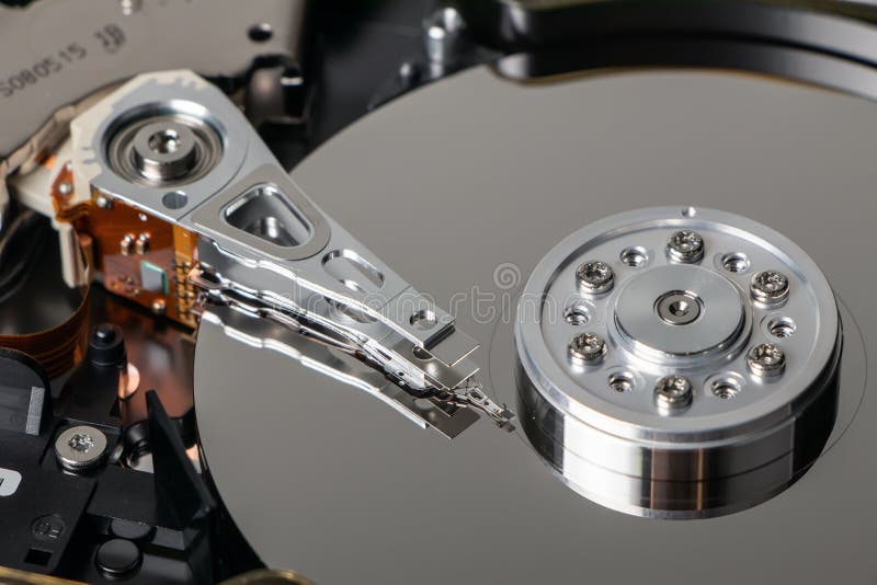 A Disassembled Open Hard Disk Drive HDD of a Computer or Laptop Lies on ...