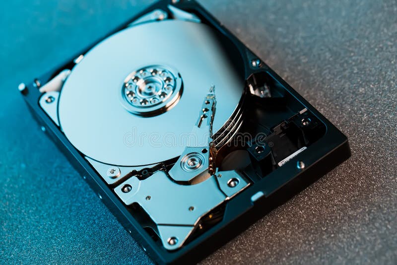 A Disassembled Open Hard Disk Drive HDD of a Computer or Laptop Lies on ...