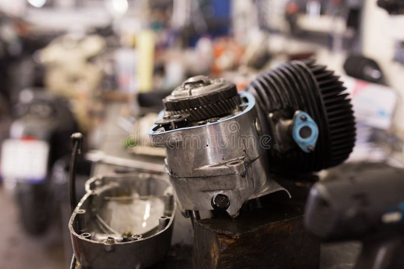 Disassembled Motorcycle Engine on a Table in Workshop Stock Photo ...