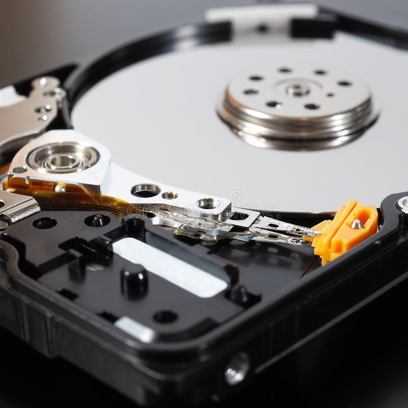 A Disassembled Open Hard Disk Drive HDD of a Computer or Laptop Lies on ...