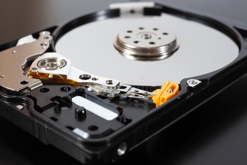A Disassembled Open Hard Disk Drive HDD of a Computer or Laptop Lies on ...