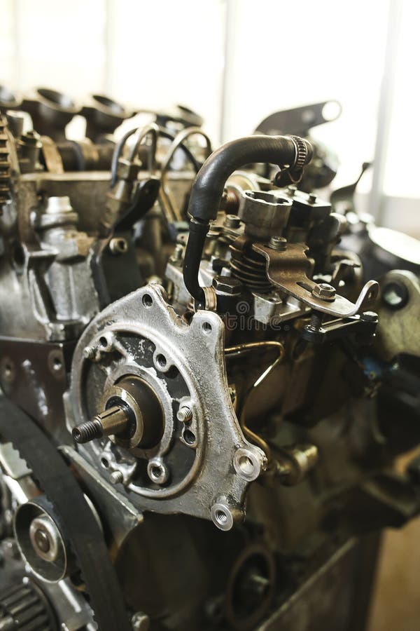 Disassembled Parts of an Open Car Engine on a Workbench Stock Image ...
