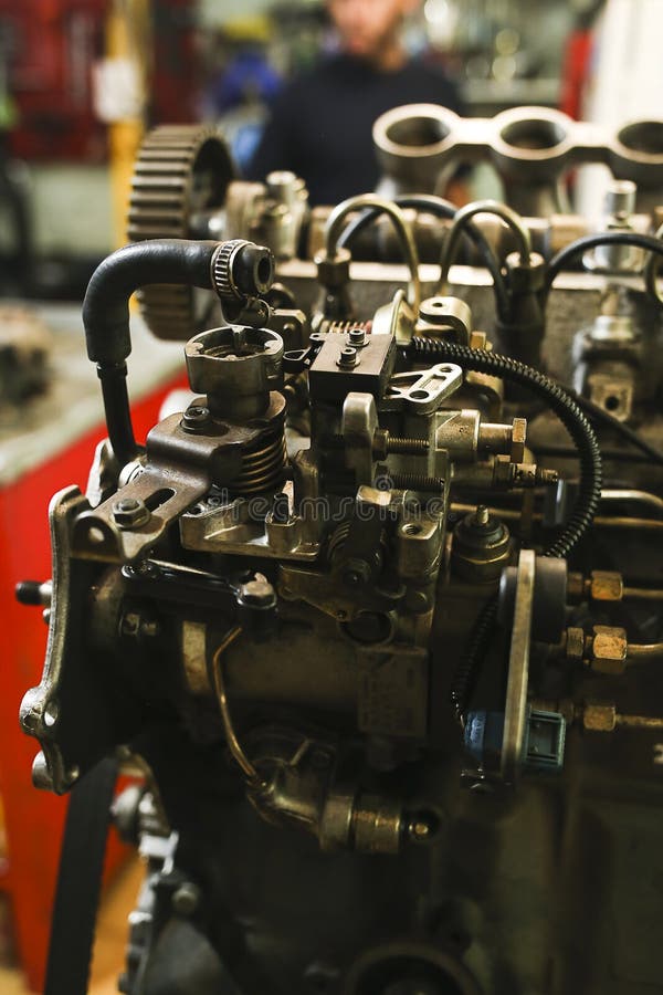 Disassembled Parts of an Open Car Engine on a Workbench Stock Image ...