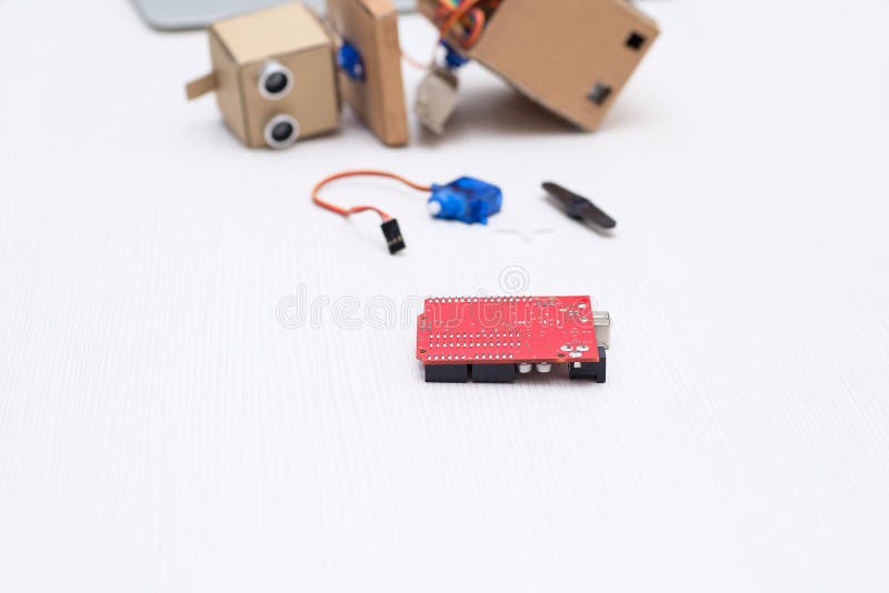 Disassembled Red Robot and Chip Lies on a White Table Stock Image ...