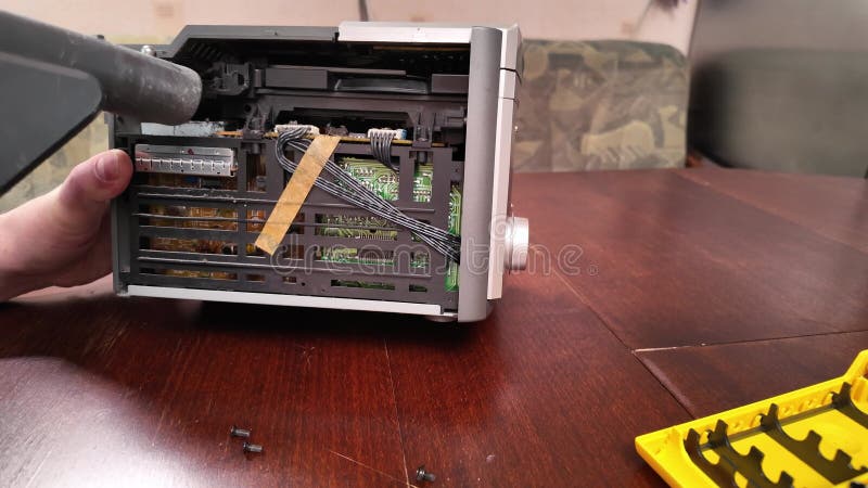 Disassembling a Stereo System for Repair with Visible Internal ...