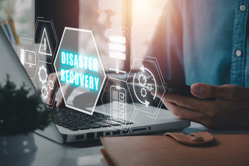 Person Hand Using Laptop Computer with Disaster Recovery Icon on ...