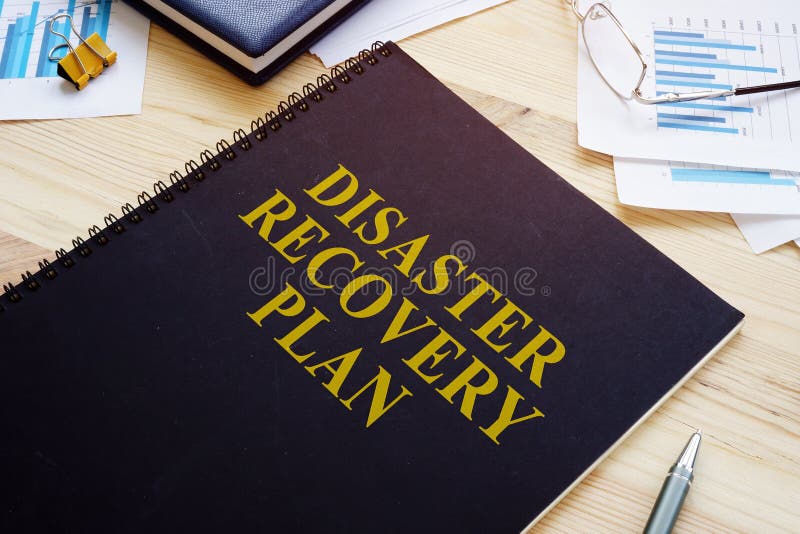 Disaster Recovery Plan Book and Stack of Papers Stock Photo - Image of ...