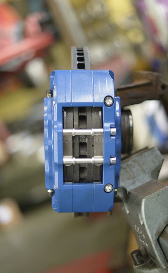 Disc and blue brake pads stock photo. Image of assembly - 49048968