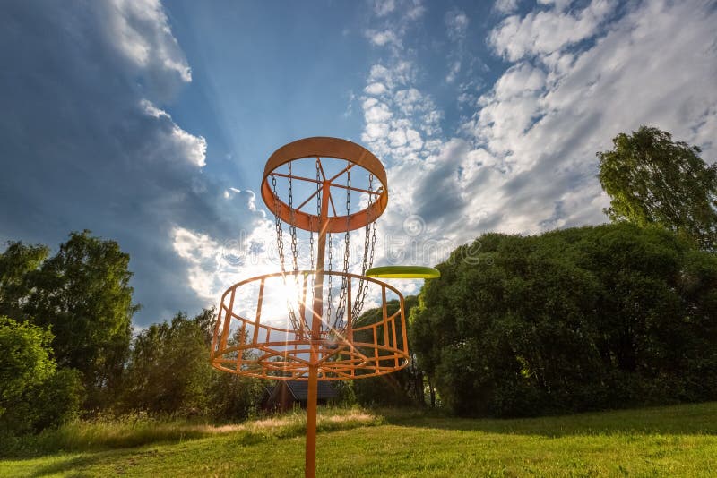 Disc Golf Basket and Flying Disc in Summer Park Stock Photo - Image of ...