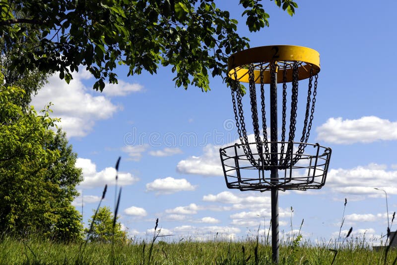 Disc golf basket on meadow stock image. Image of green - 284667151
