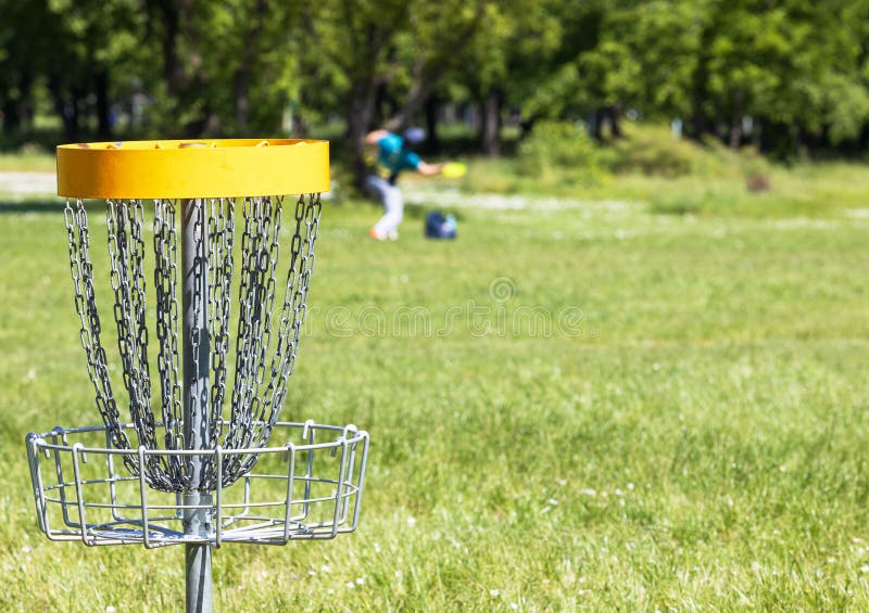 Disc Golf Player Throwing a Flying Disc in the Public Park Stock Image ...