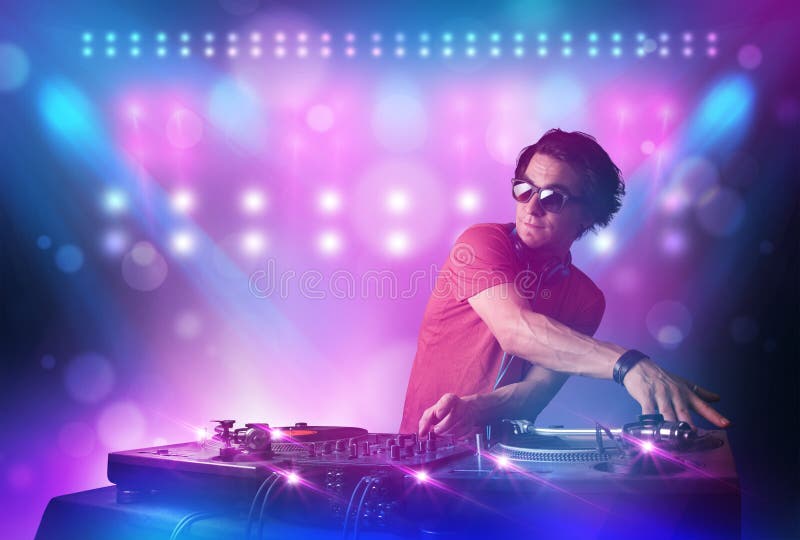Disc Jockey Mixing Music on Turntables on Stage with Lights and Stock ...