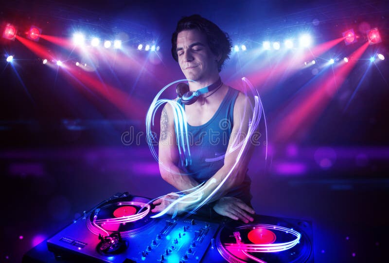 Disc Jockey Playing Music with Light Beam Effects on Stage Stock Photo ...