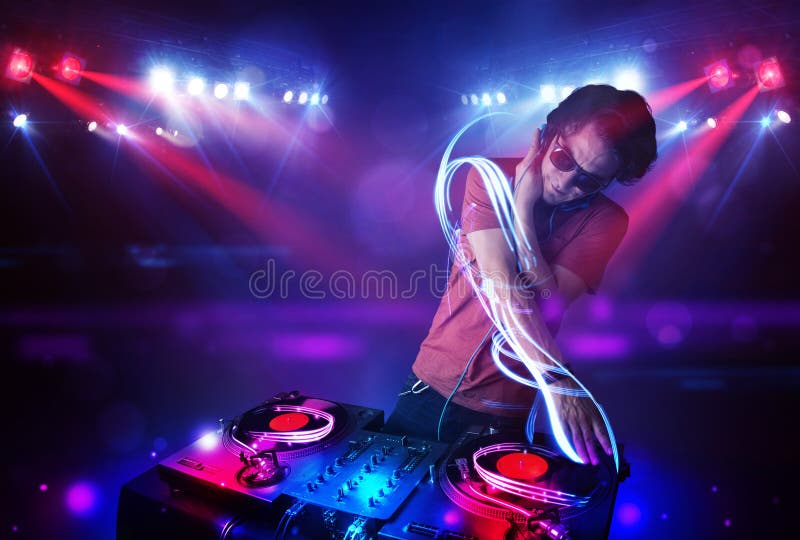 Disc Jockey Mixing Music on Turntables on Stage with Lights and Stock ...