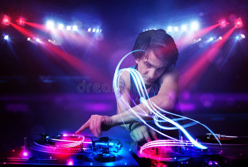 Disc Jockey Playing Music with Light Beam Effects on Stage Stock Photo ...