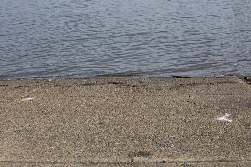 Garbage on a Lake Boat Ramp Stock Photo - Image of debris, edge: 86325868