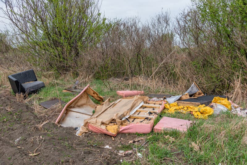 Discarded Furniture in Nature. Garbage Dumped in Beautiful Nature Stock ...